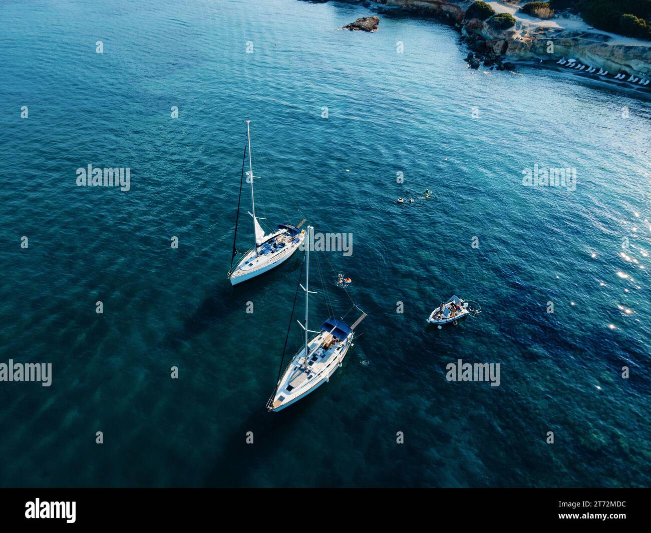 Aerial view of luxury yachts, sailing yachts, clear blue water. Travel ...