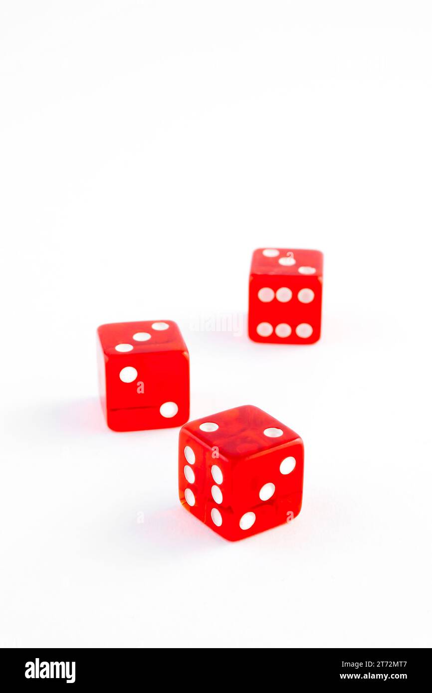 detail of three red dice on white background Stock Photo - Alamy