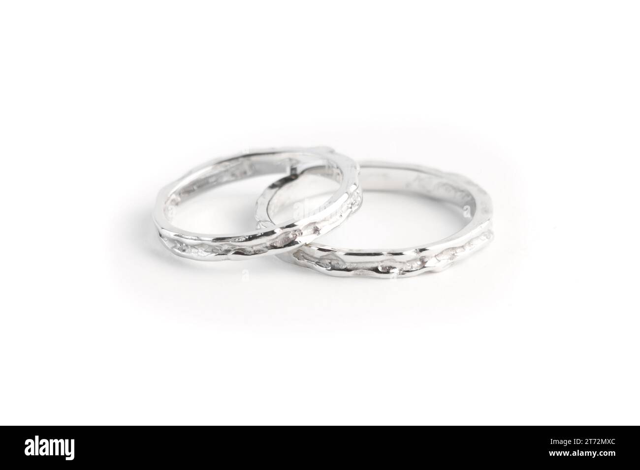 two white gold rings stacked together on white background Stock Photo ...