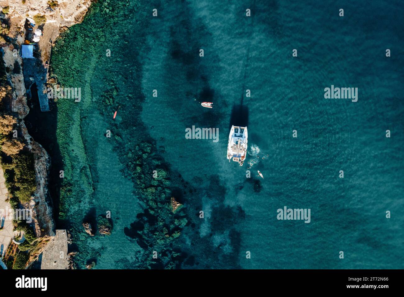 Amazing top view of Catamaran anchored in blue sea. Travel background ...