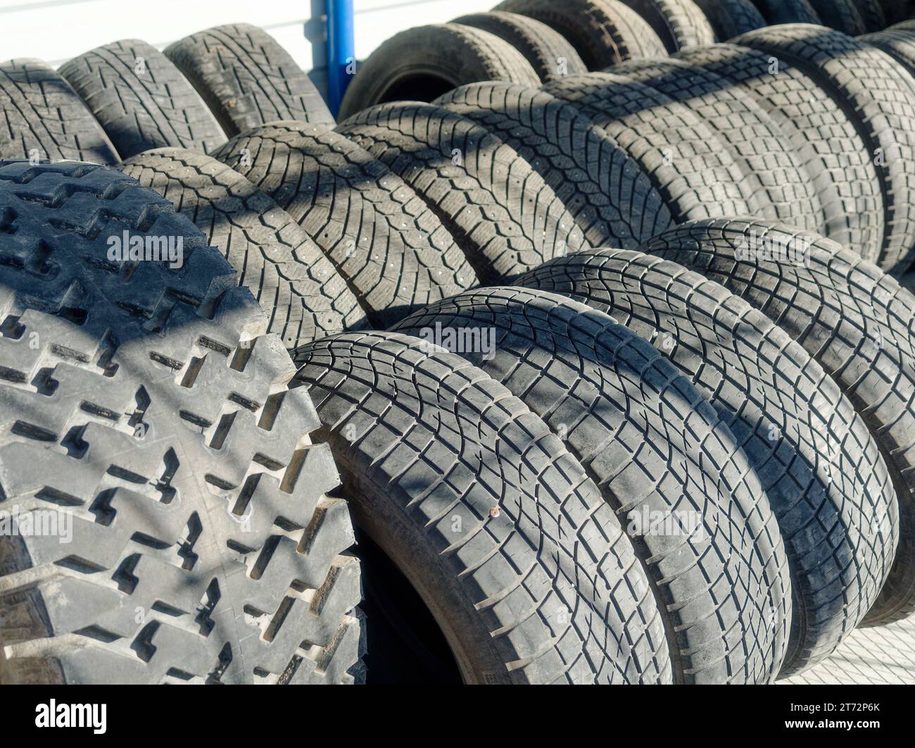 Used car tires. Rubber wheel tires. Recycling of old worn-out truck ...