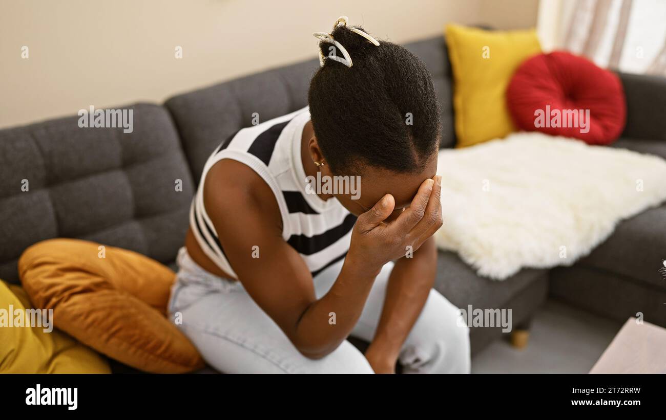 Stressed african american woman alone at home, depression seeping in as ...