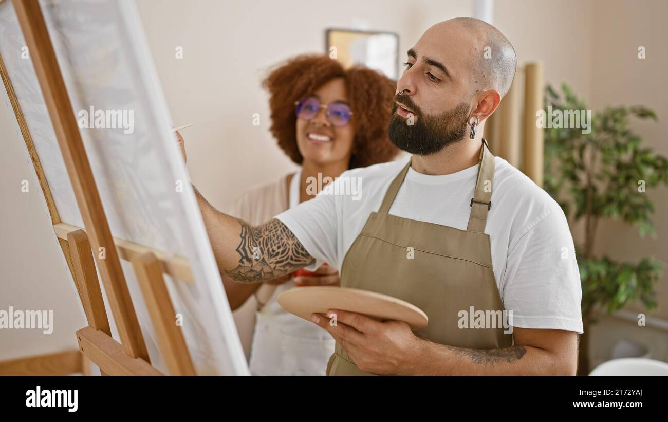 Two confident artist partners smiling together, energetically drawing ...