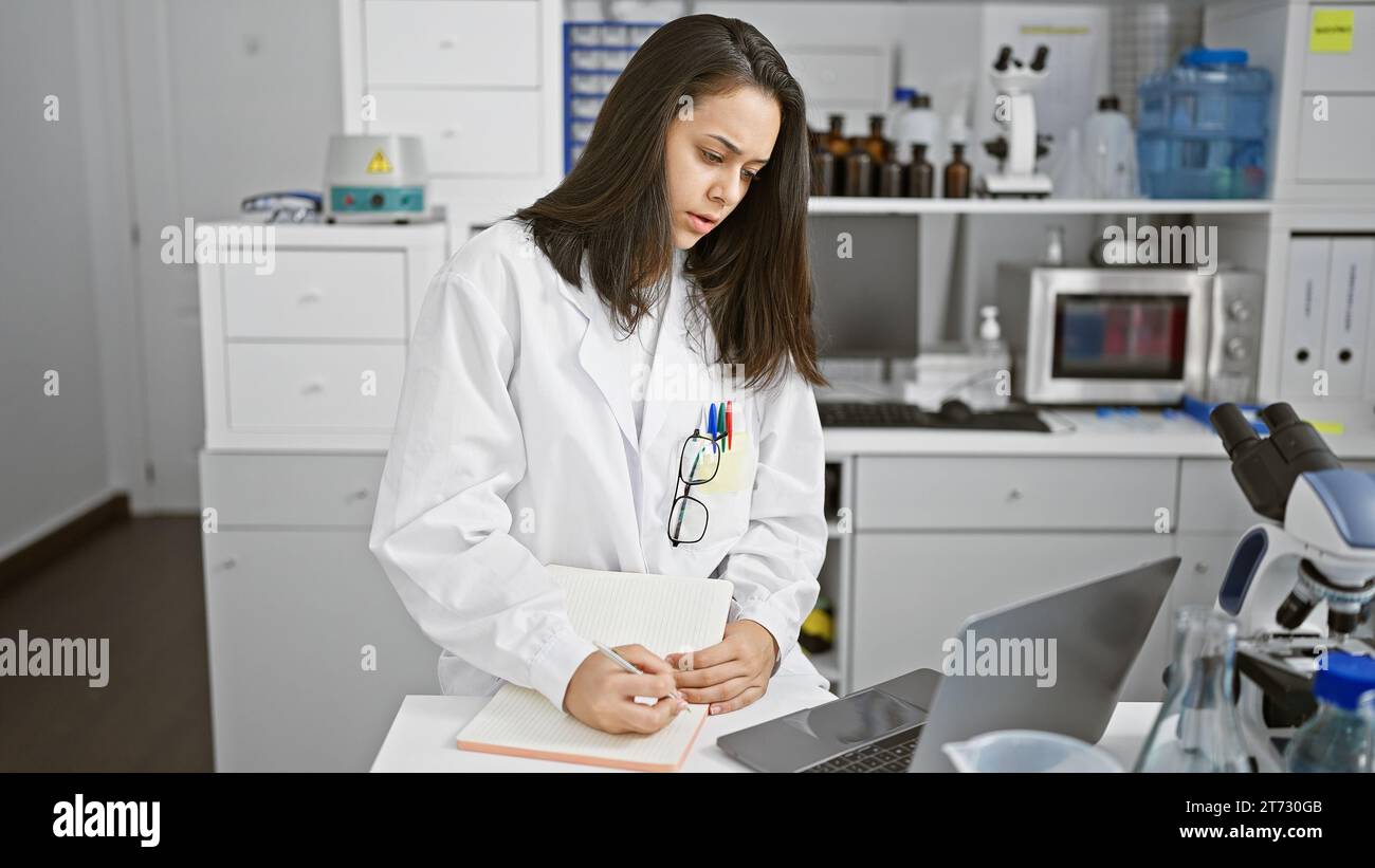 Portrait of a focused young hispanic woman, a beautiful scientist ...