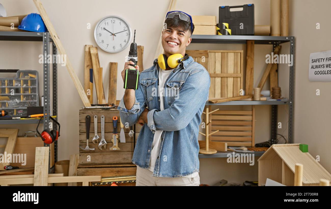 Young hispanic man carpenter wearing glasses and headphones holding ...