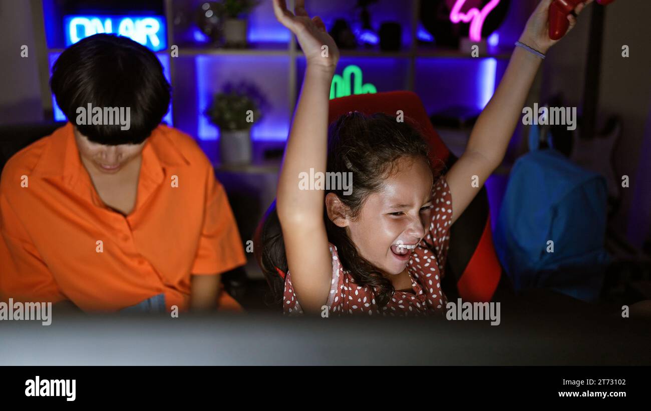 Joystick joy! mother and daughter gamer streamers celebrating a ...