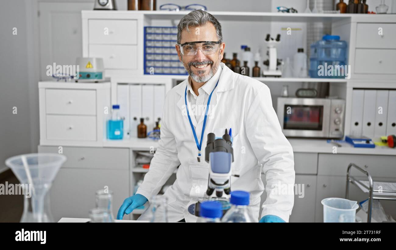 Confident young hispanic man, a grey-haired scientist with a charming ...