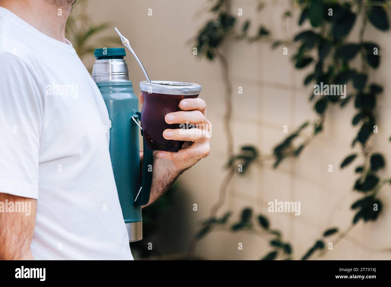 A man with a thermos and gourd mate. Yerba Mate, traditional South ...