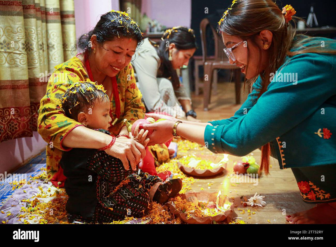 Bhaktapur, Bagmati, Nepal. 13th Nov, 2023. A Family member clelebrates ...
