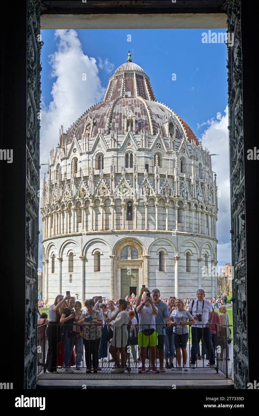 The Baptistry, Pisa cathedral, Tuscany, seen from through the doors of ...