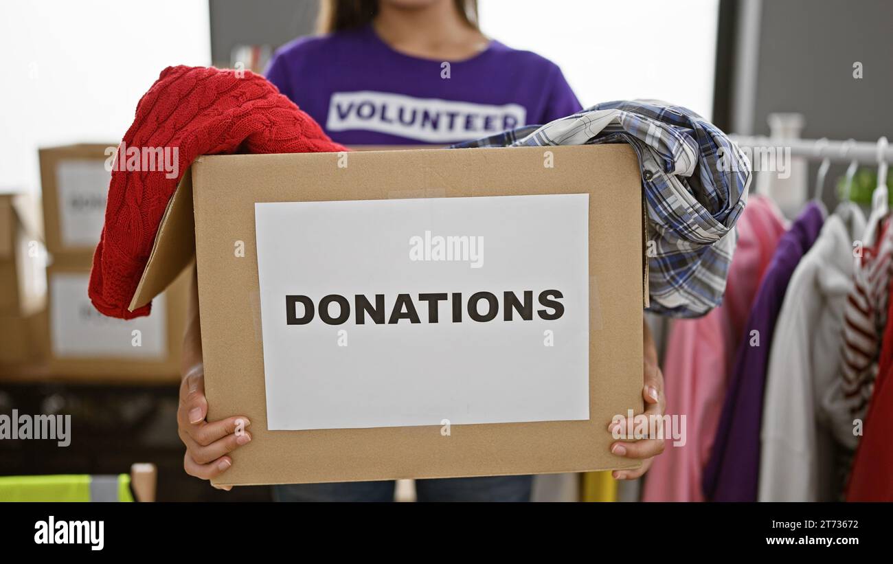 Altruistic hands of a community-service driven hispanic woman volunteer ...