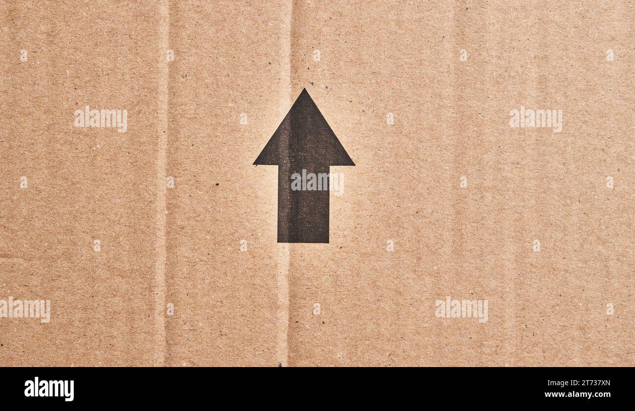 Brown cardboard carton material with arrow texture background Stock ...