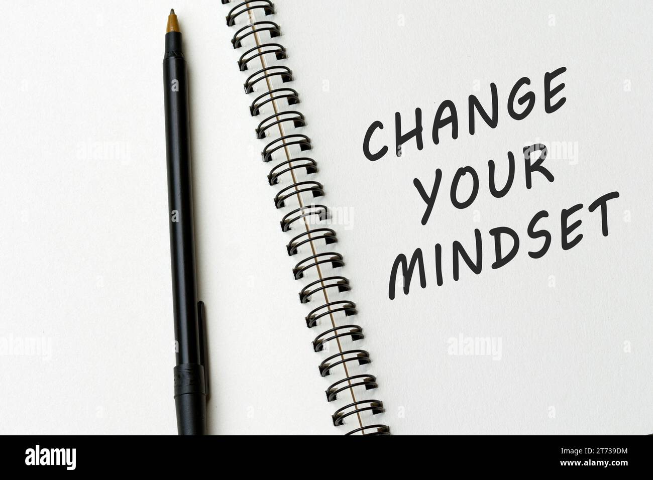 Motivational and inspirational quote on notepad - Change your mindset Stock Photo - Alamy