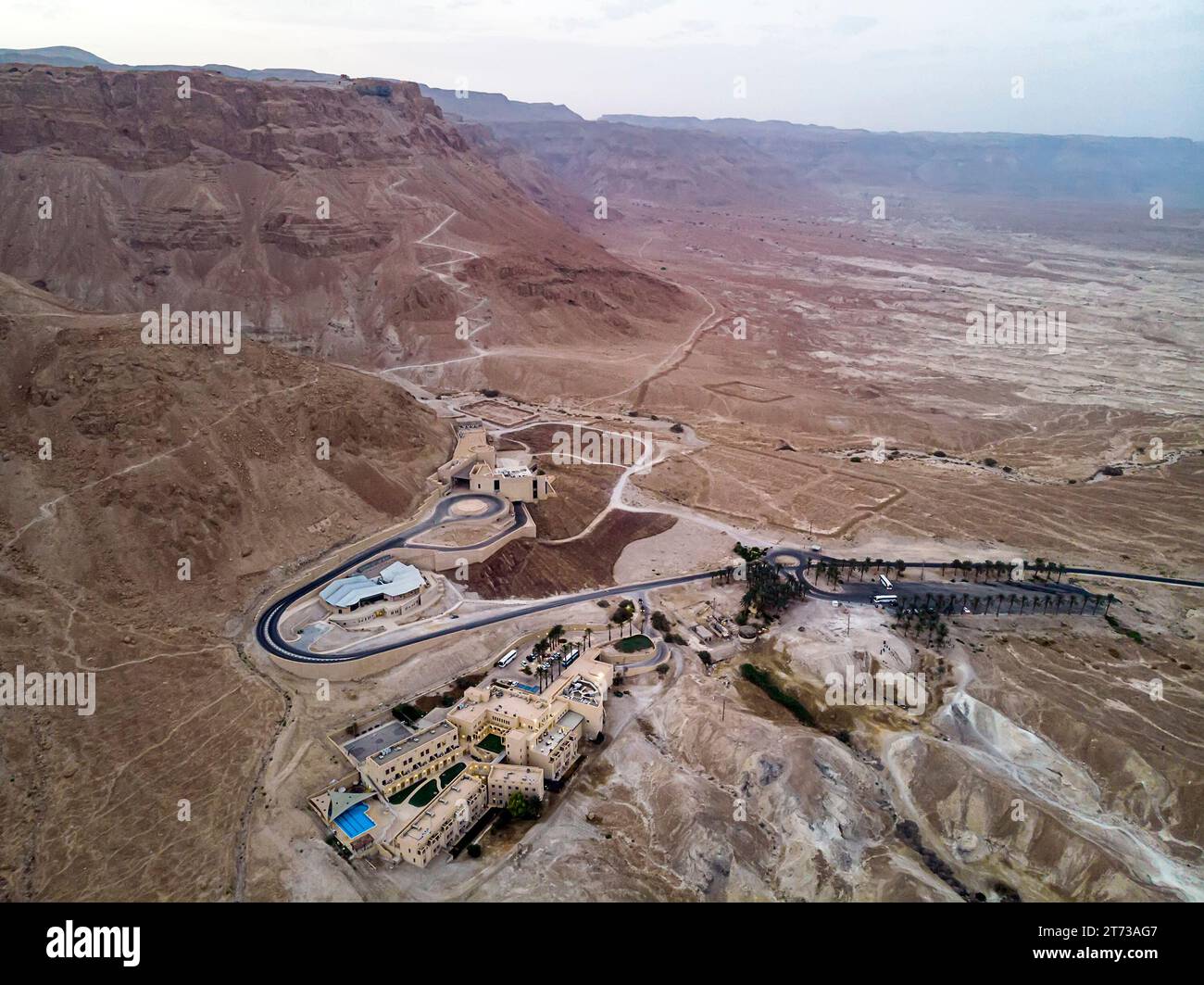 Aerial view of the winding highway and isolated residential area built ...