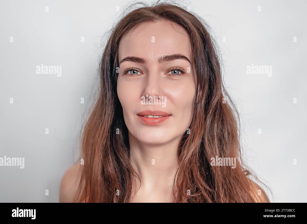 Portrait Of A Dreamy Woman With Long Dark Hair And Big Blue Eyes Stock