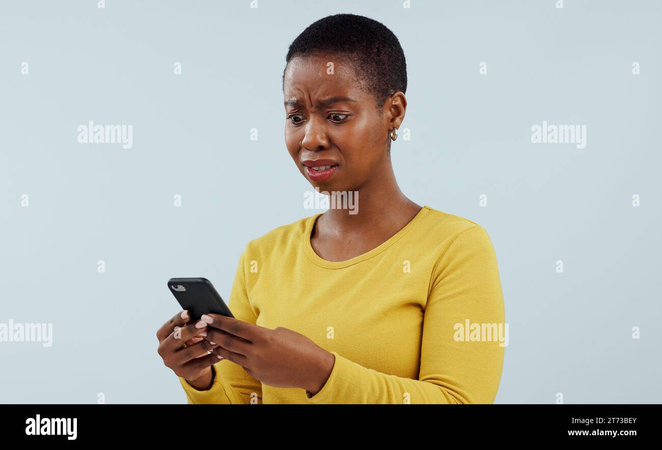 Frustrated black woman, phone and shocking news on social media ...