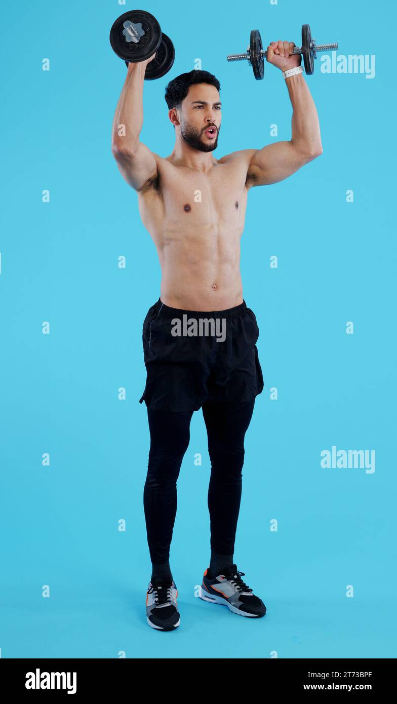 Fitness, dumbbells and man stretching in studio for training, exercise ...