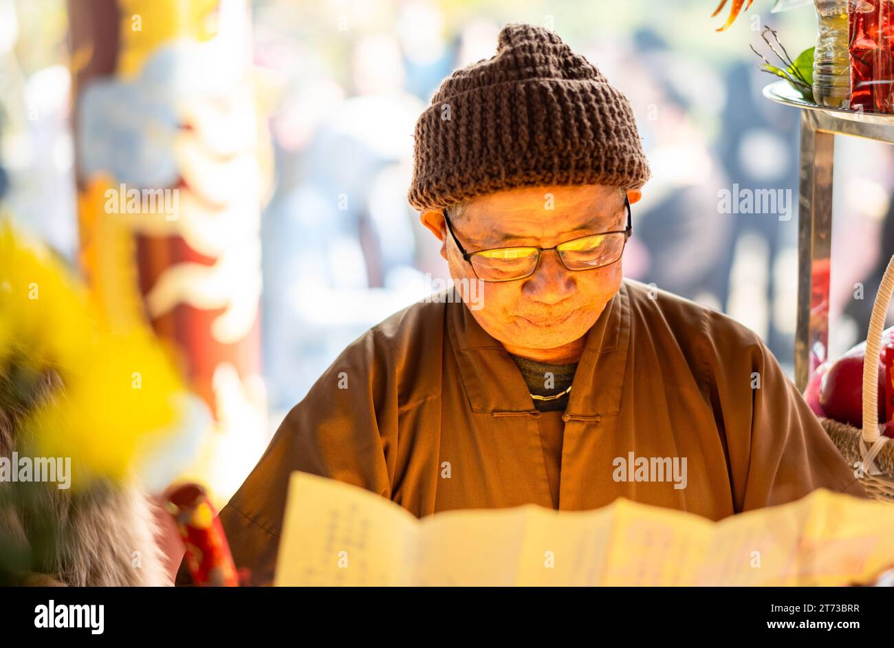 A Vietnamese buddhist monk prays at lunar new year at the 17th century ...