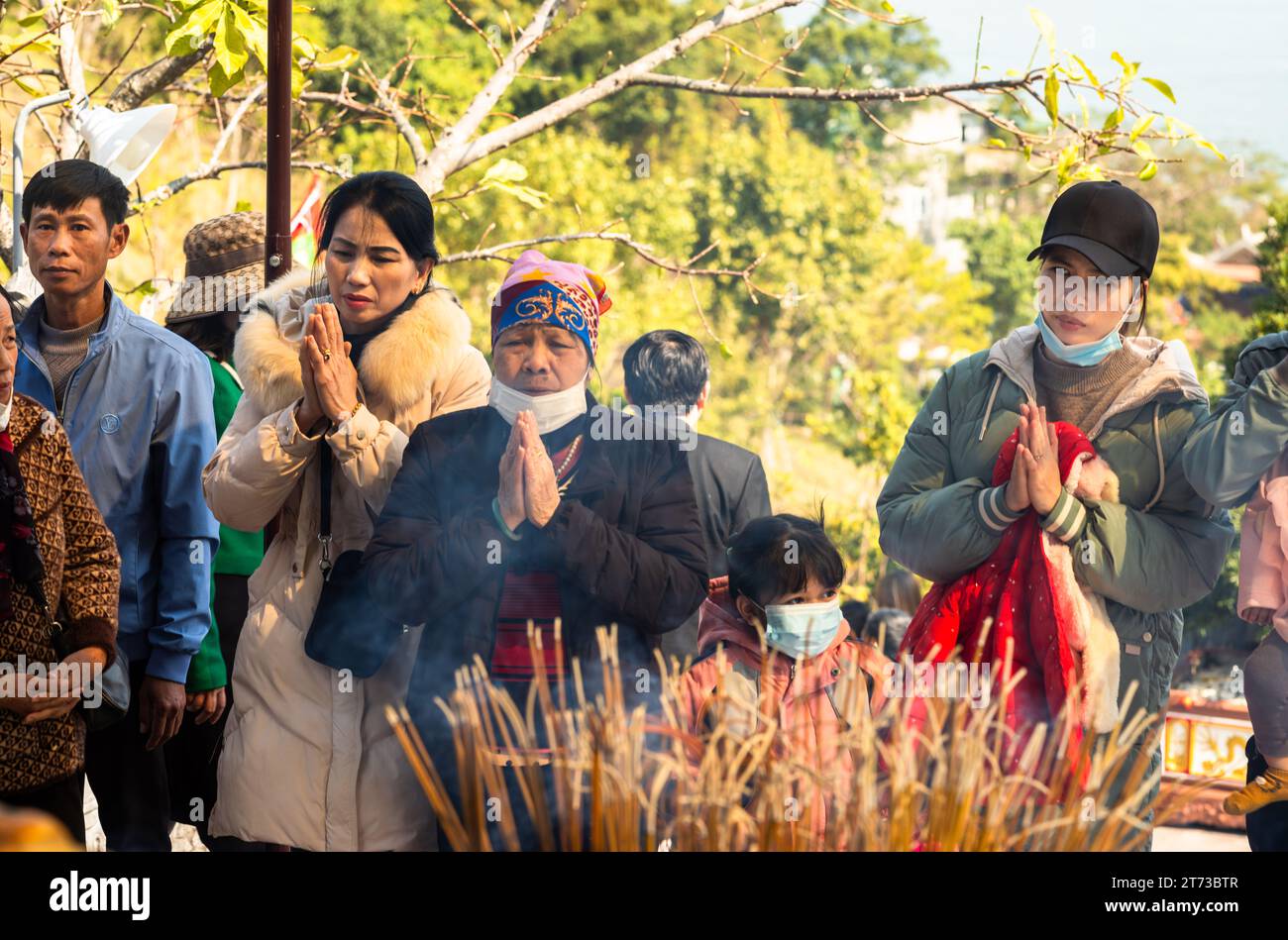 Vietnamese people pray at lunar new year as they visit the 17th century ...