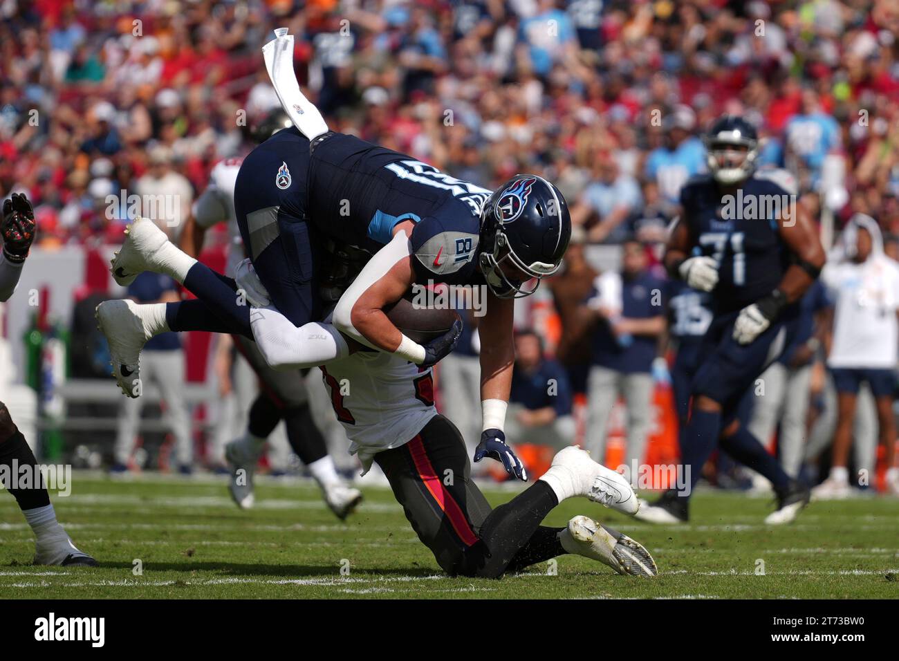Tennessee Titans tight end Josh Whyle (81) gets upended by a defender ...