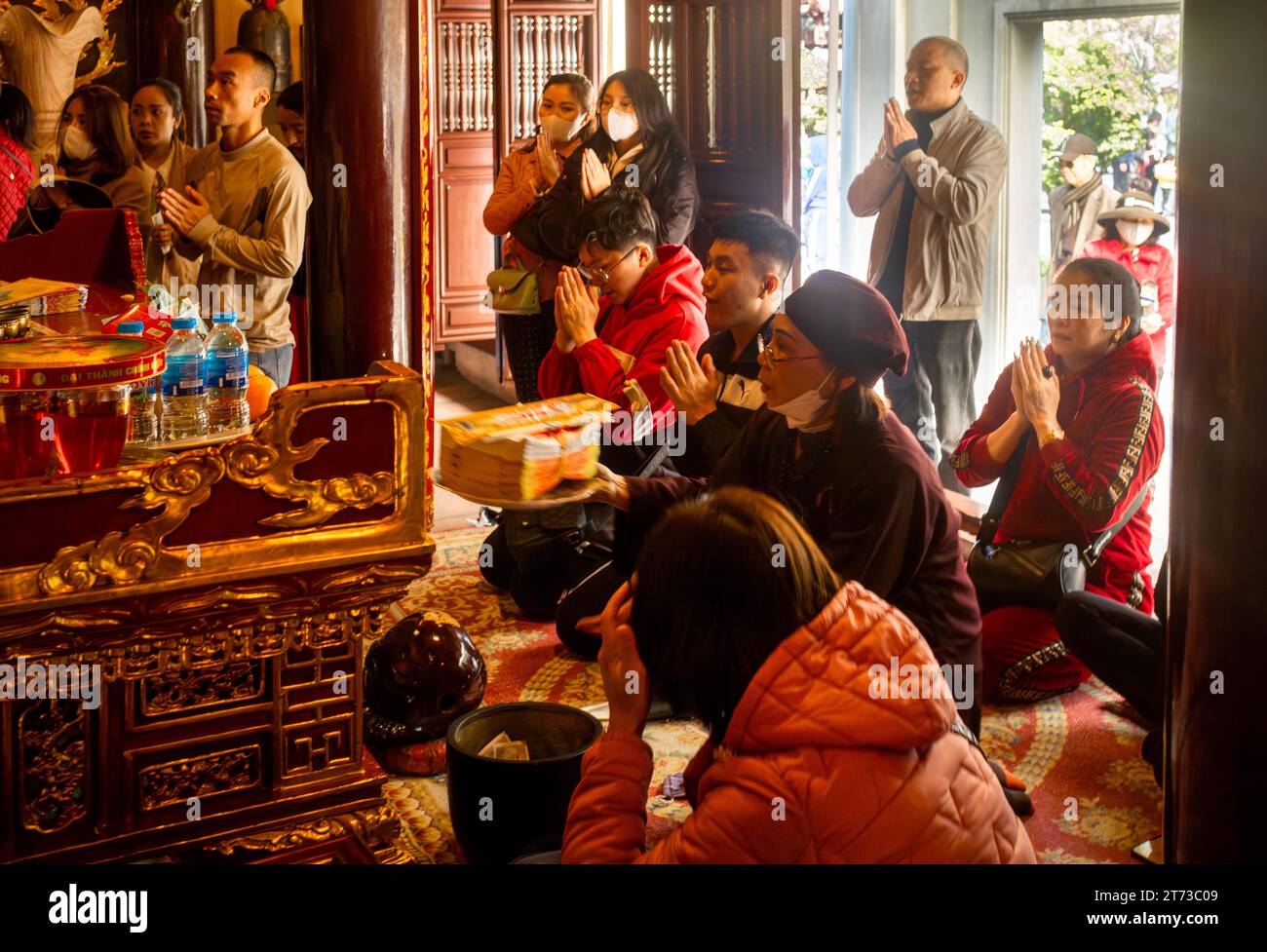 Vietnamese people pray at lunar new year as they visit the 17th century ...