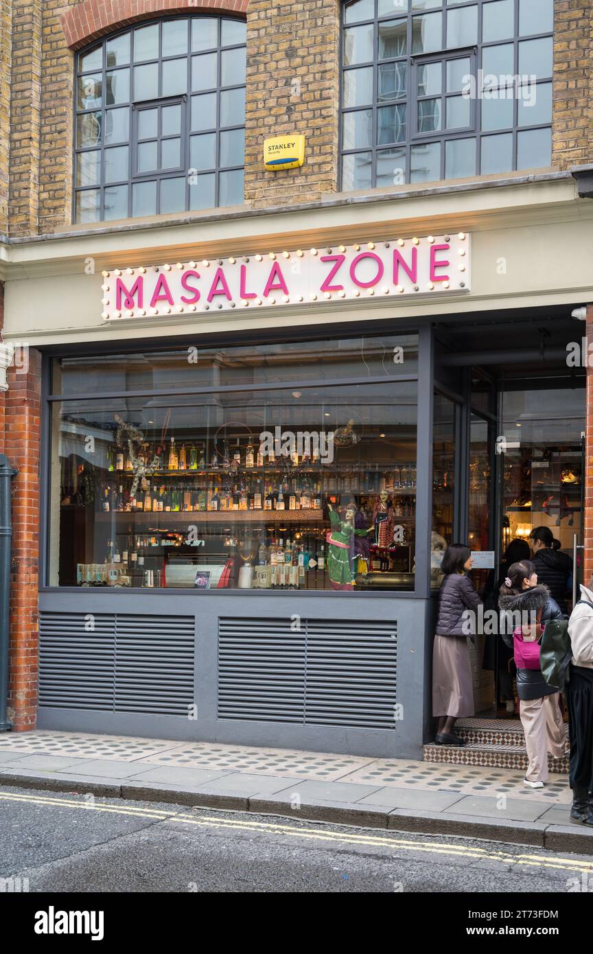 People entering Masala Zone, an Indian restaurant on Floral Street ...