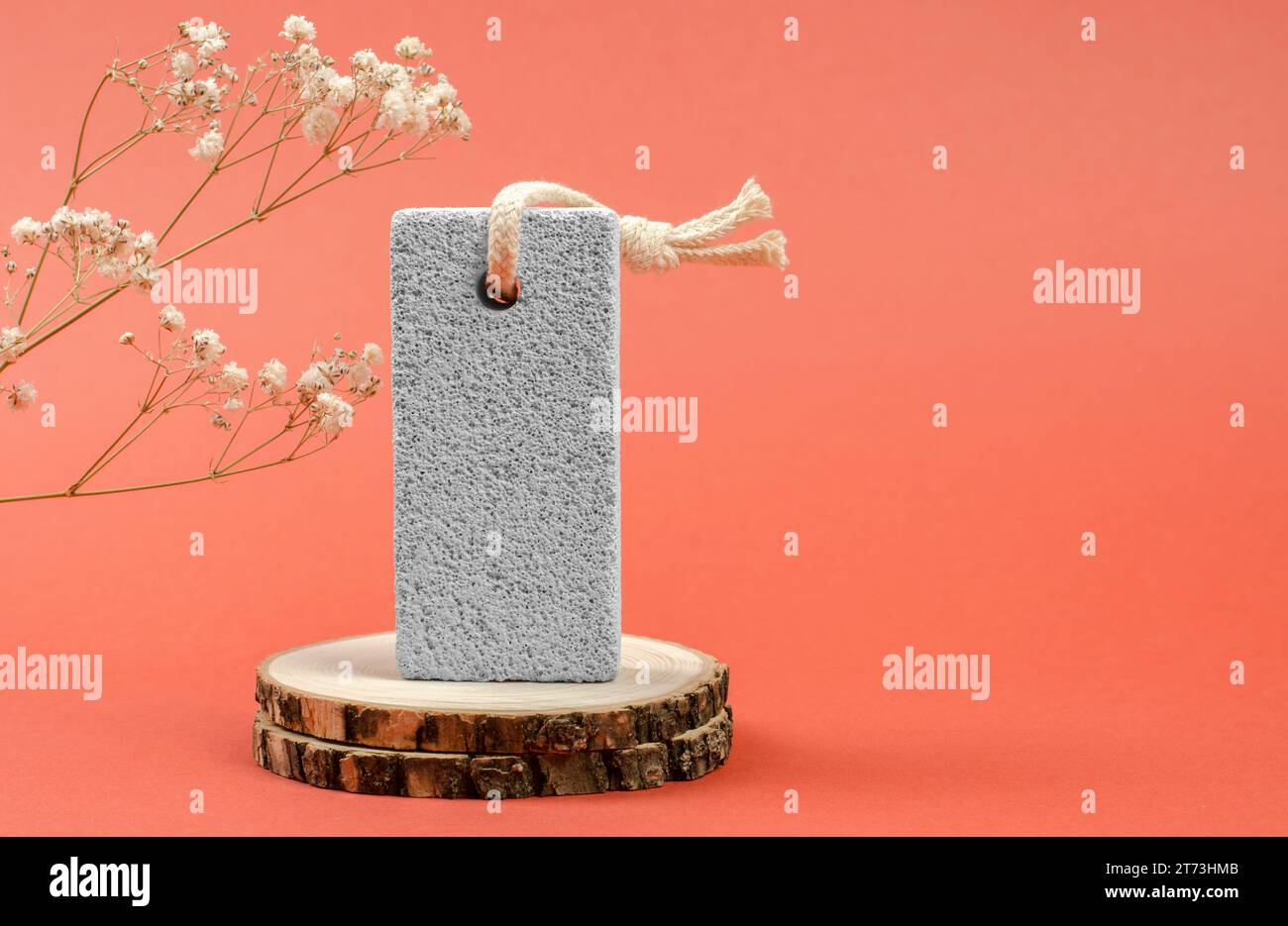 Pumice for feet on a wooden podium. Foot care concept Stock Photo - Alamy