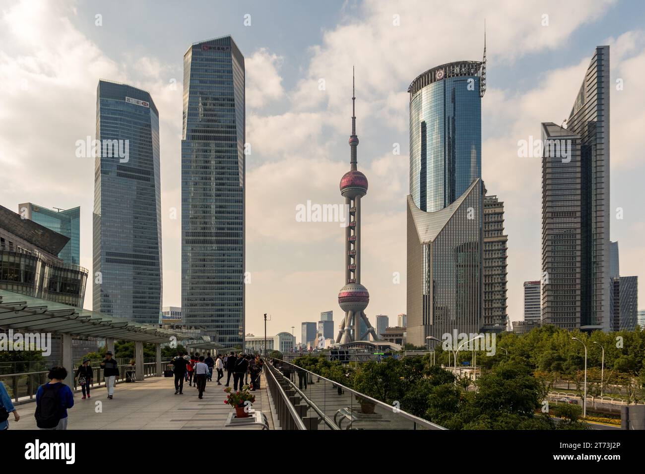 Pedestrians walk in downtown Shanghai, China Stock Photo - Alamy