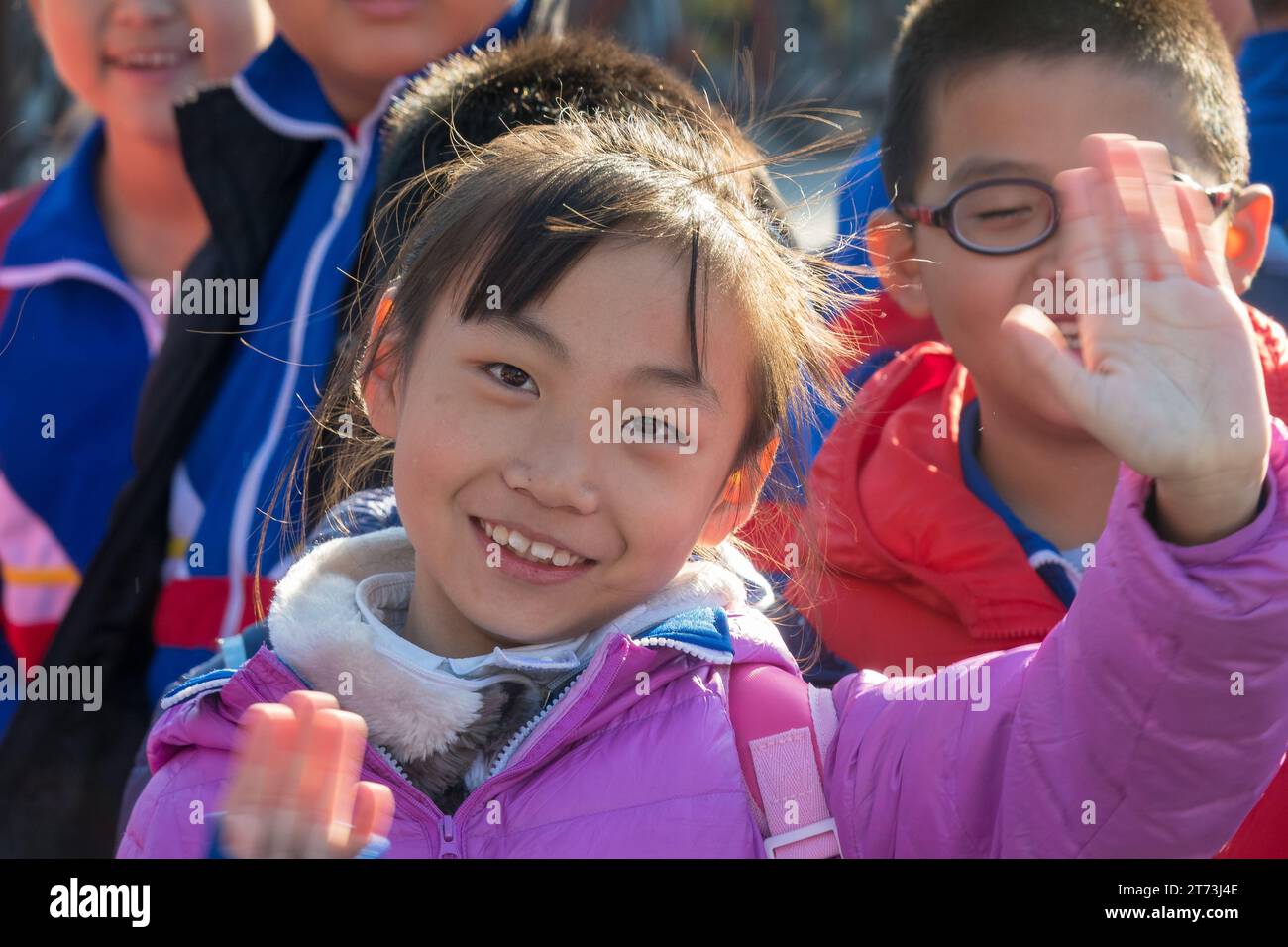 A young Chinese girl greeting me with her most beautiful smile Stock ...