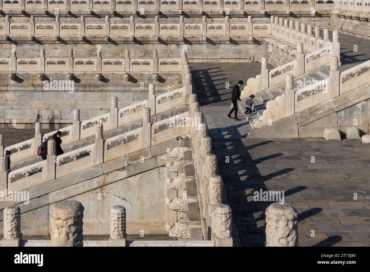A father and his child climb the steps of the monumental staircase ...