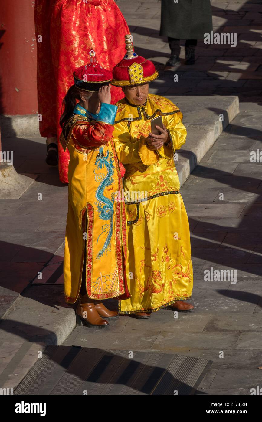 Striking contrast between the traditional Chinese costumes of these ...