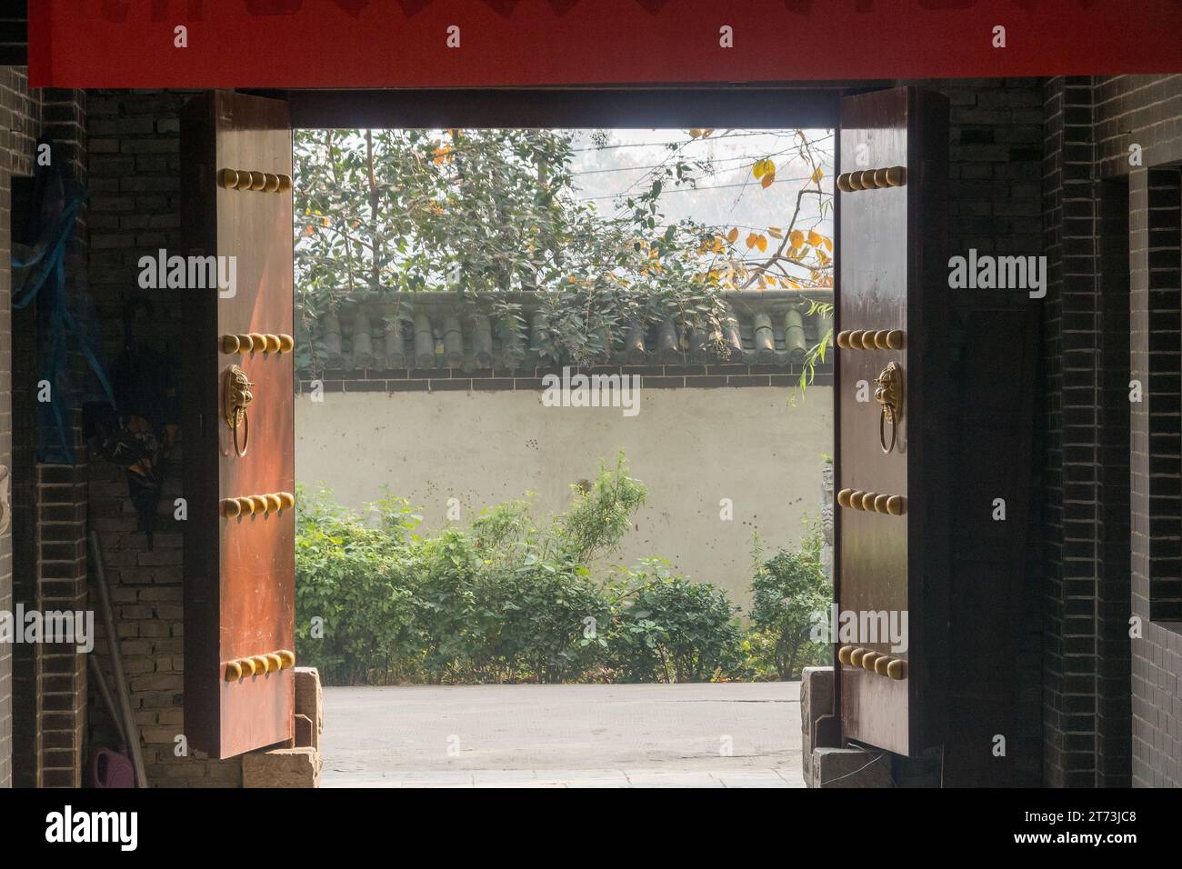 Open doors leading to an exterior courtyard in a Chimes building Stock ...