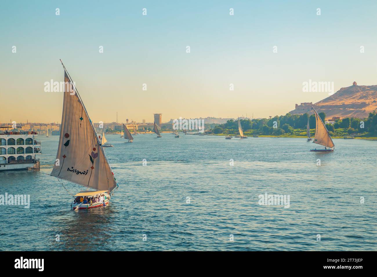 Traditional felucca boats on the Nile River in Aswan. Magnificent view ...
