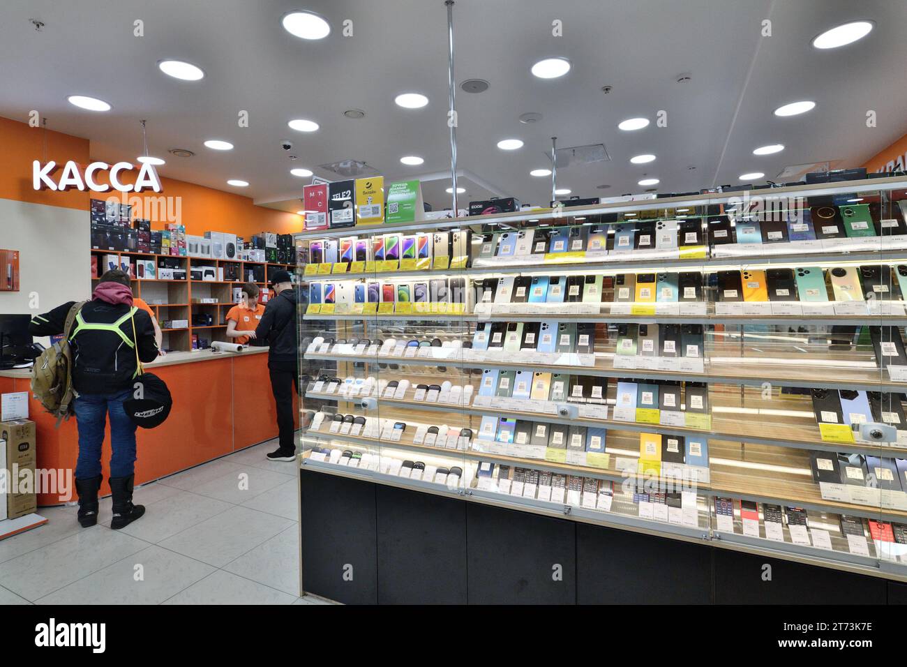 Moscow, Russia - Nov 11. 2023. Cell phones and wireless headphones in ...