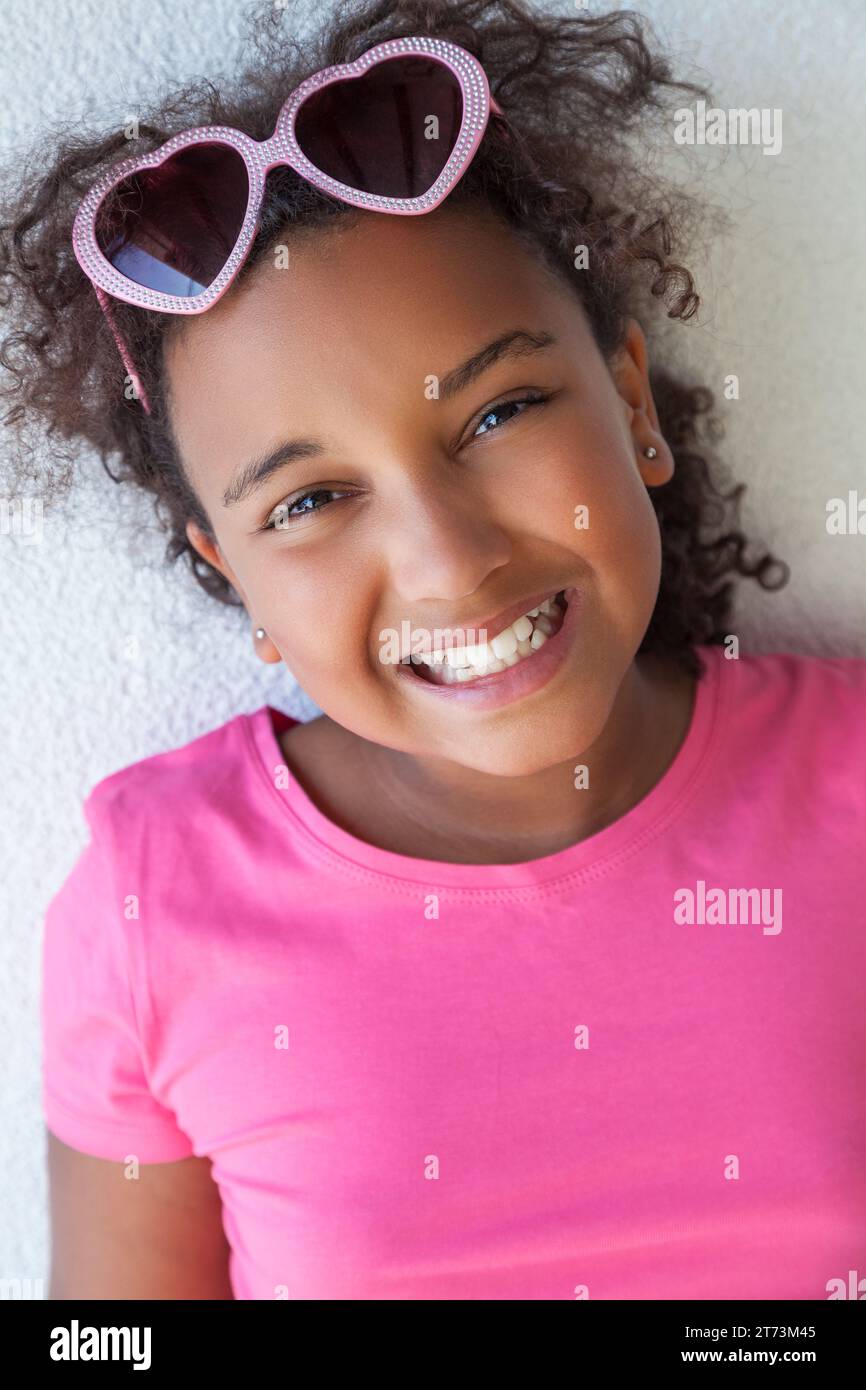 Happy smiling mixed race biracial African American female girl child ...