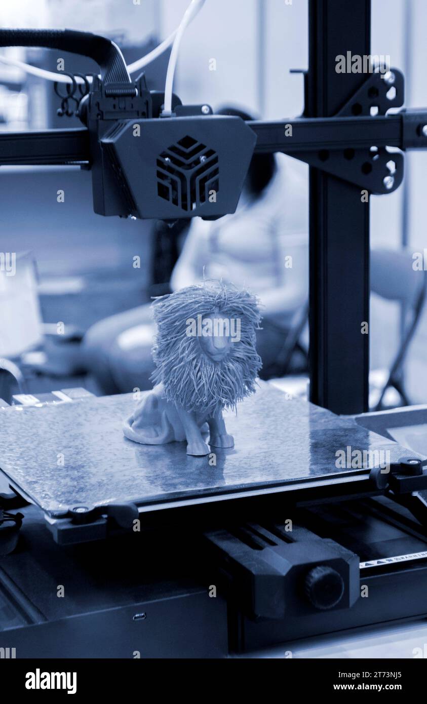 Model of toy lion printed on 3D printer from melted plastic blue color ...