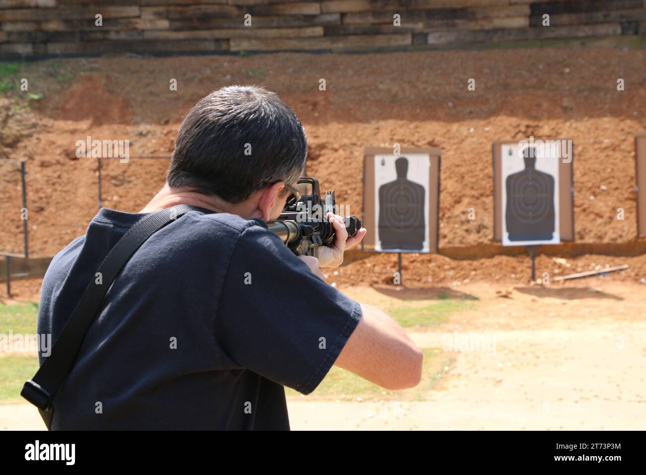 A police officer training with a rifle at the range Stock Photo - Alamy