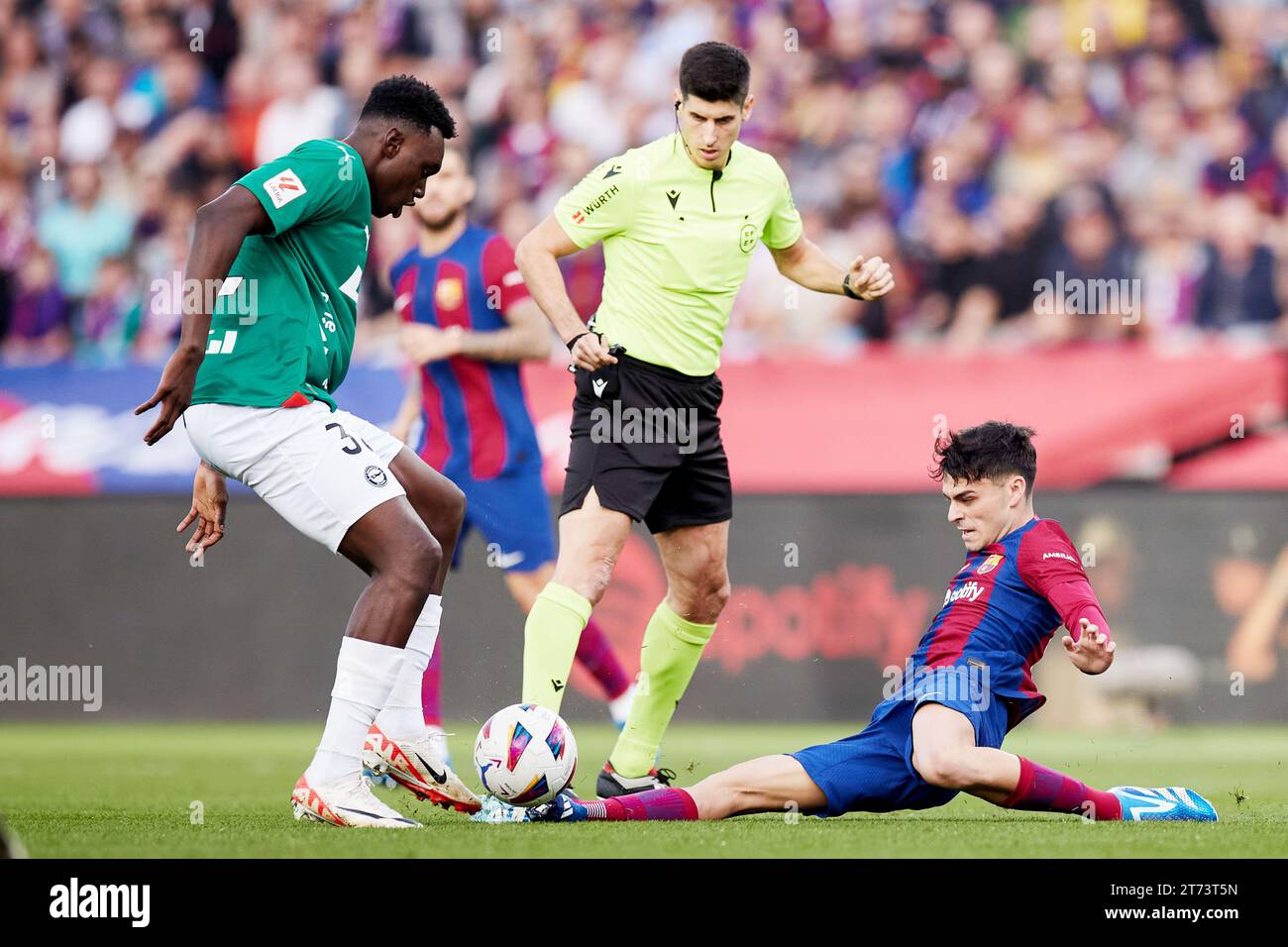 Samu Omorodion of Deportivo Alaves and Pedri Gonzalez of FC Barcelona ...