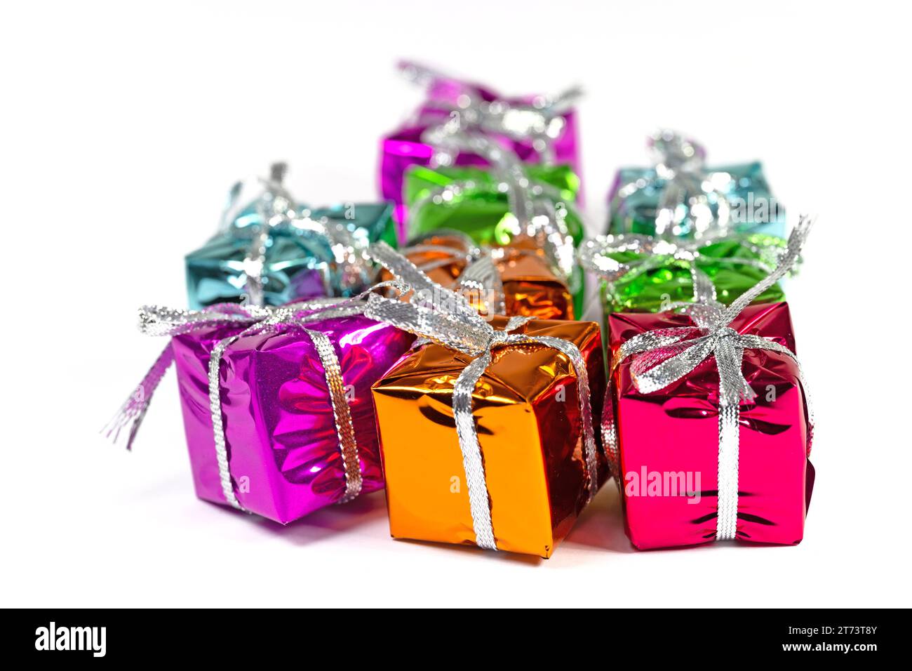 Colorful shiny packages against white background Stock Photo - Alamy