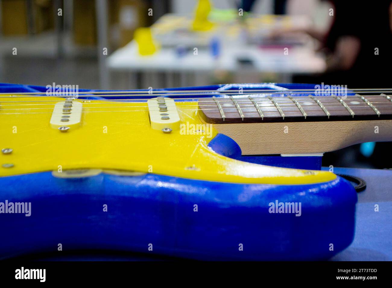 Musical instrument guitar 3D printed from molten plastic in yellow and ...