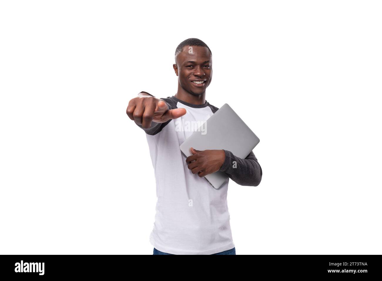 young successful student african guy with short haircut uses laptop for ...