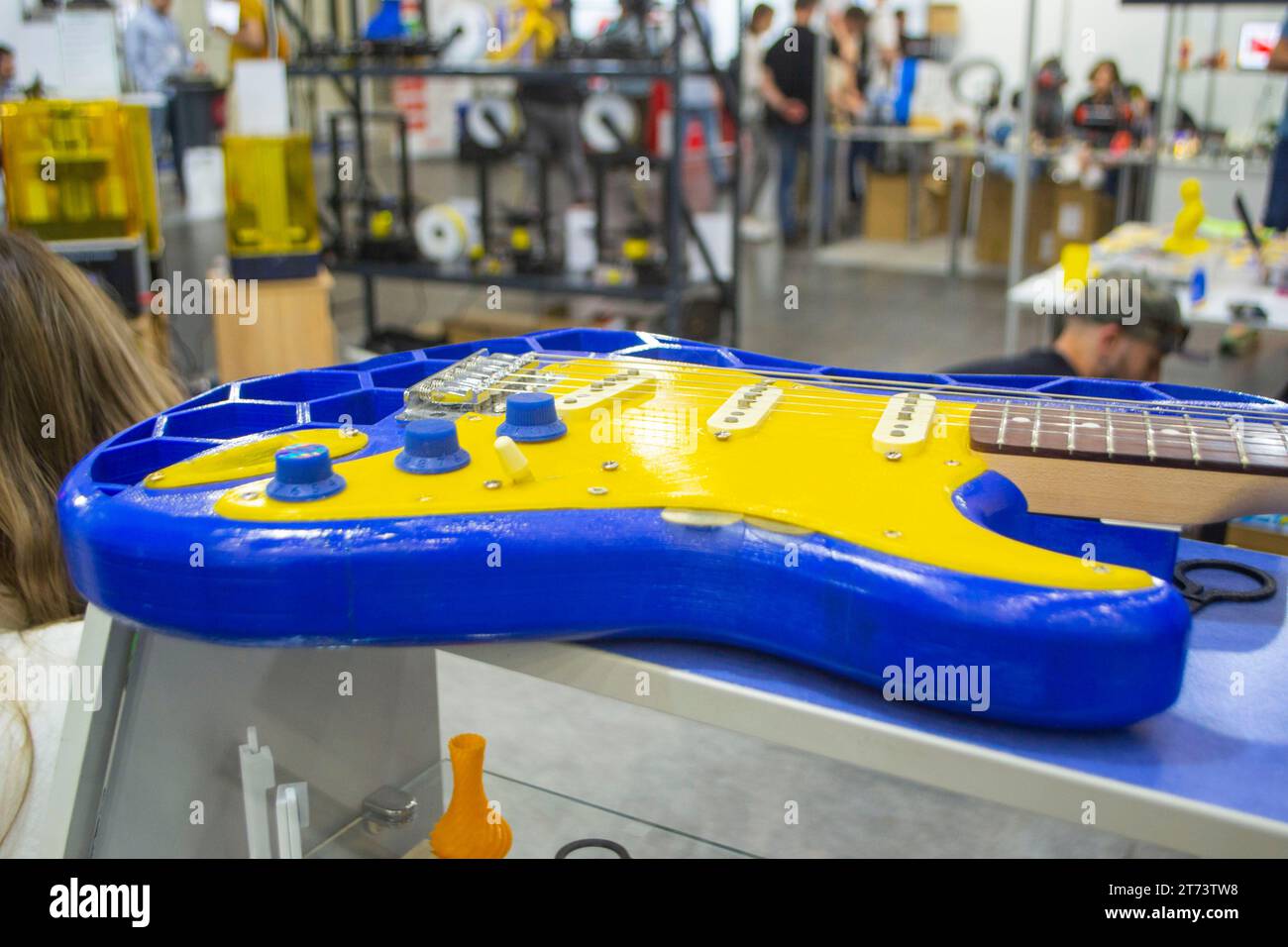 Musical instrument guitar 3D printed from molten plastic in yellow and ...