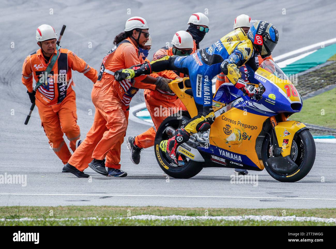 Kuala Lumpur, Malaysia. 12th Nov, 2023. Track Marshalls push the bike of Spanish rider Manual ...