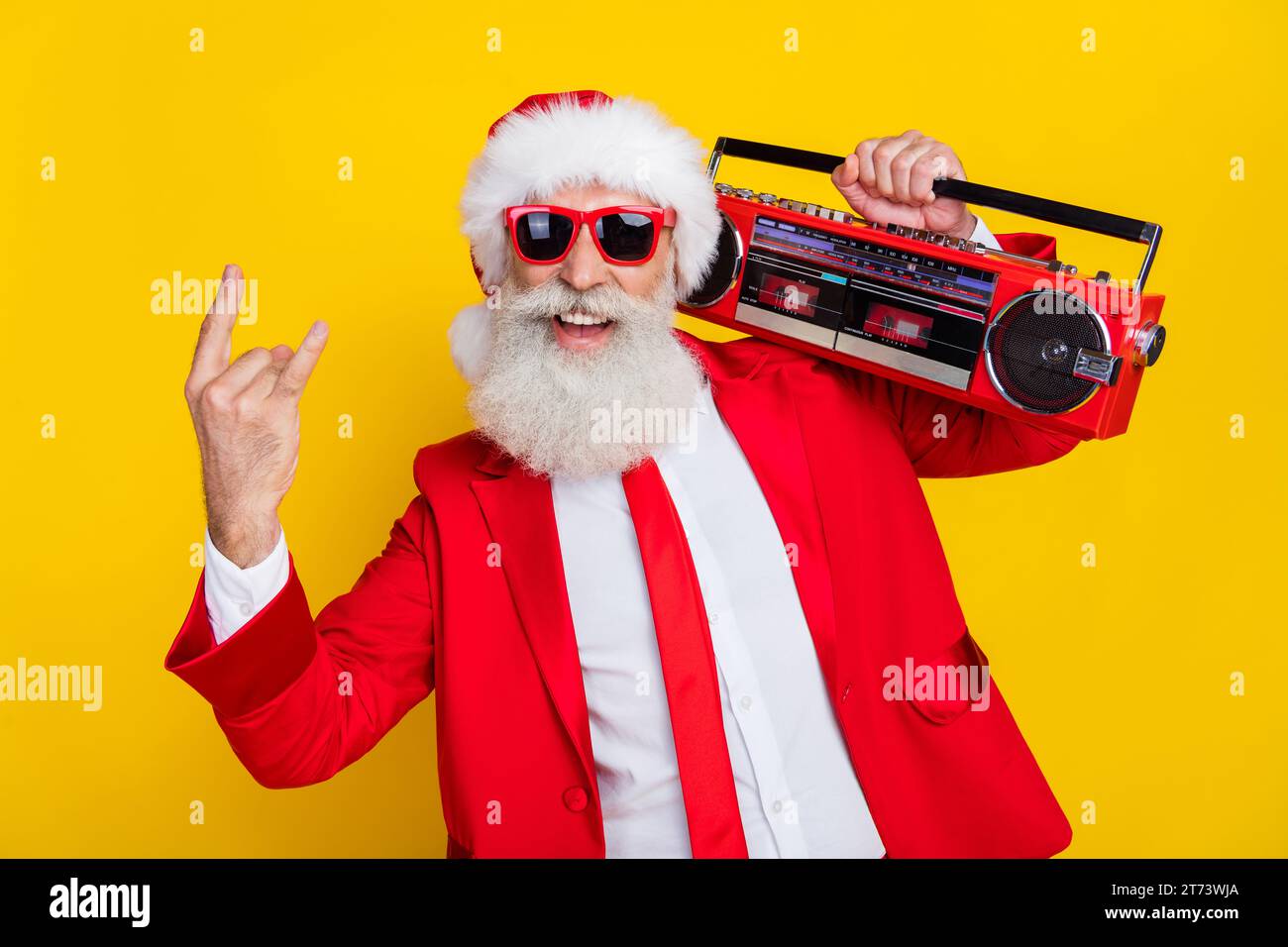 Photo of cool attractive santa dressed red suit tie enjoying boom box ...