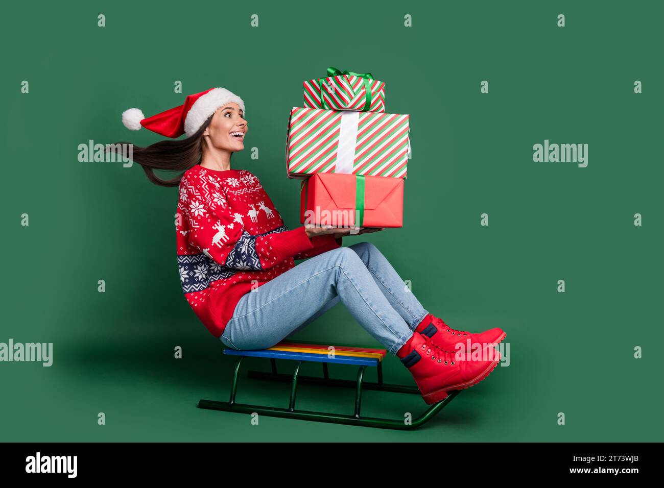Full body photo of surprised young girl ride sleigh have fun wear ugly ...