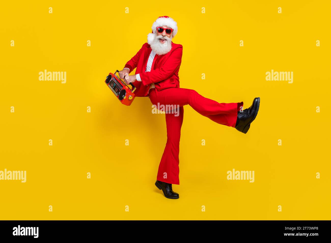 Full size portrait of positive funky man dancing hands hold boombox ...