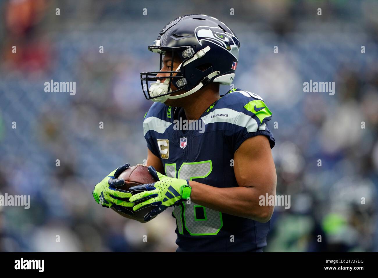 Seattle Seahawks wide receiver Tyler Lockett warms up before an NFL ...