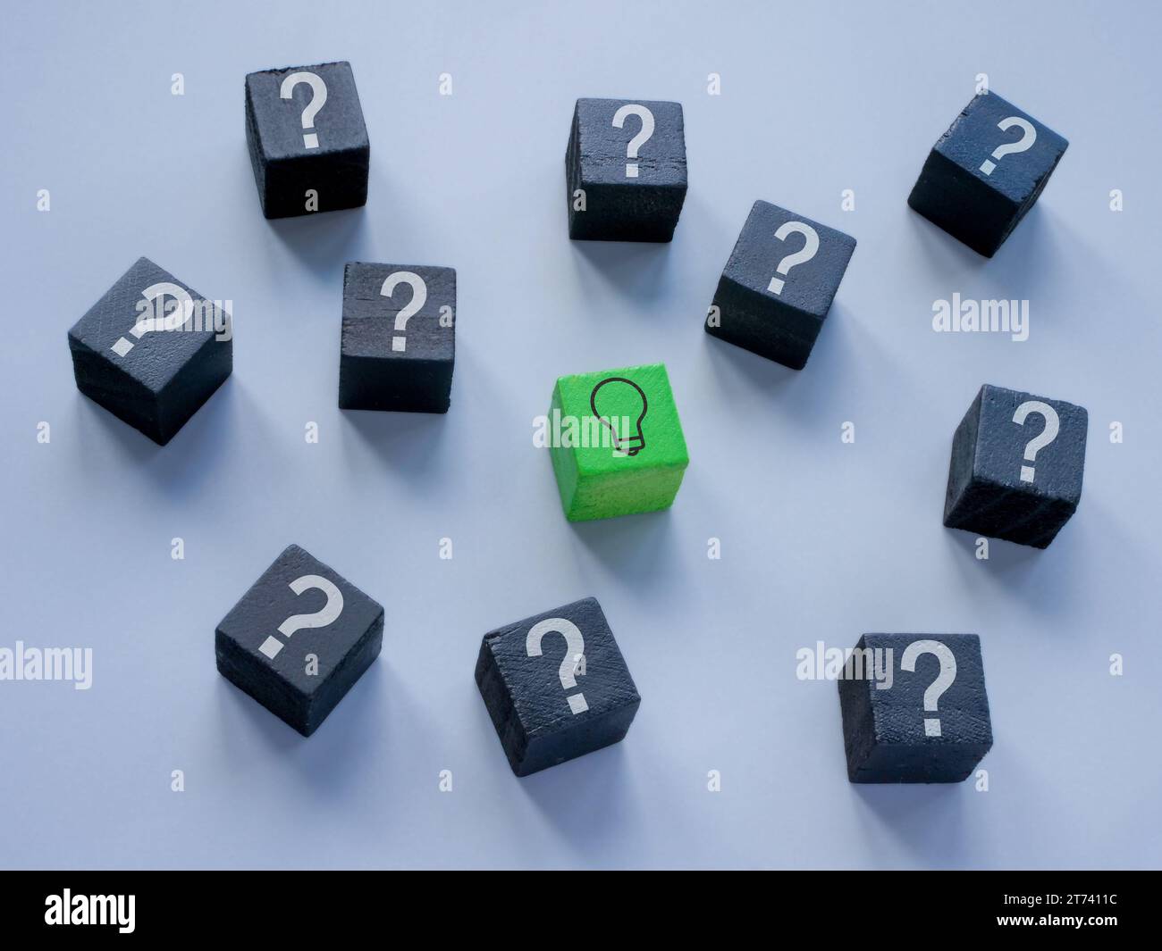 Cubes with question marks and one with a light bulb as a concept for an ...