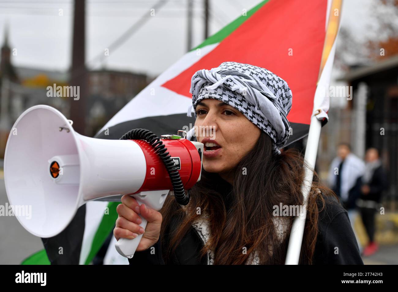 A protester chants pro-Palestinian slogans through a megaphone during ...