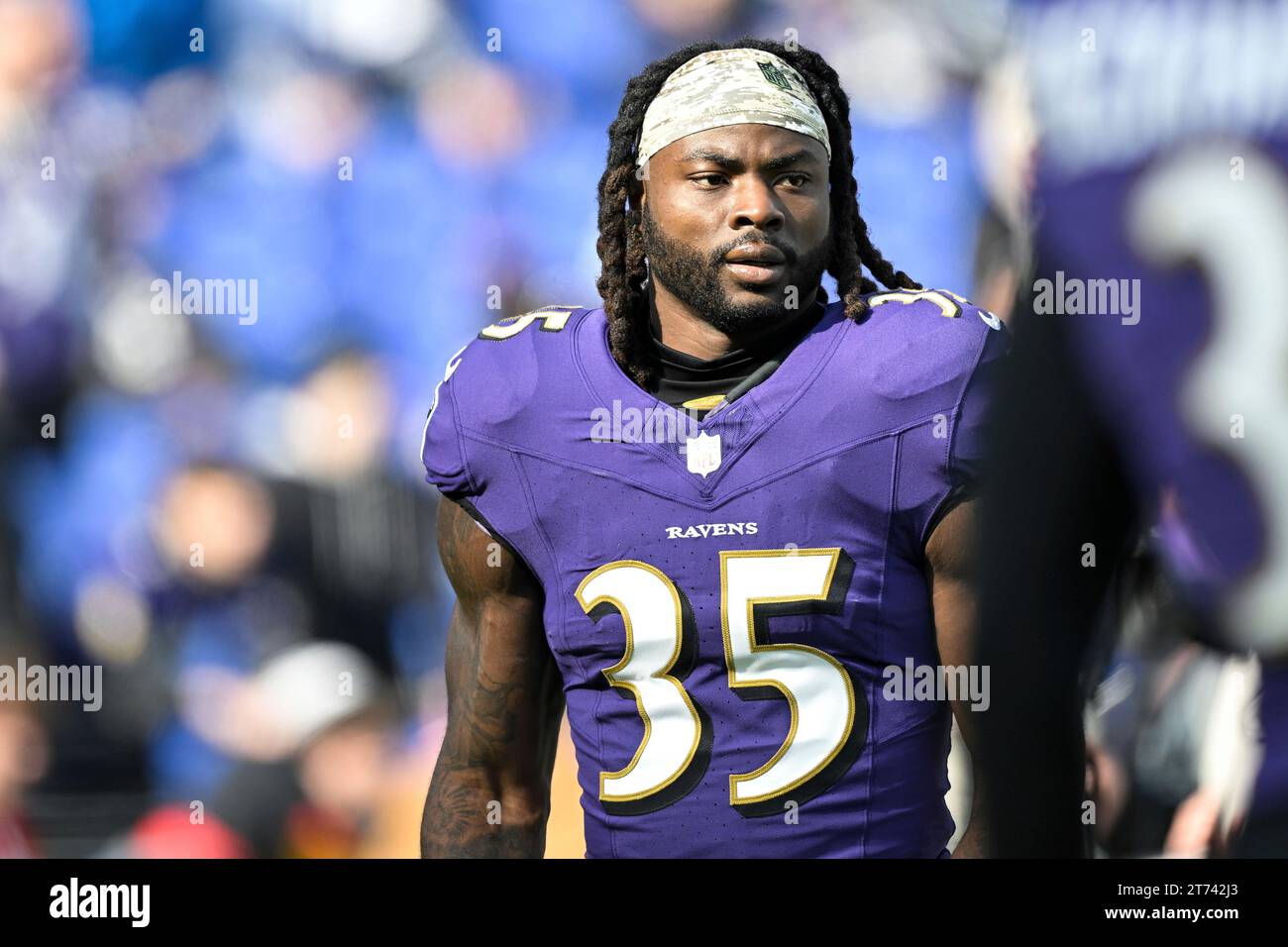 Baltimore Ravens running back Gus Edwards (35) looks on during pre-game ...